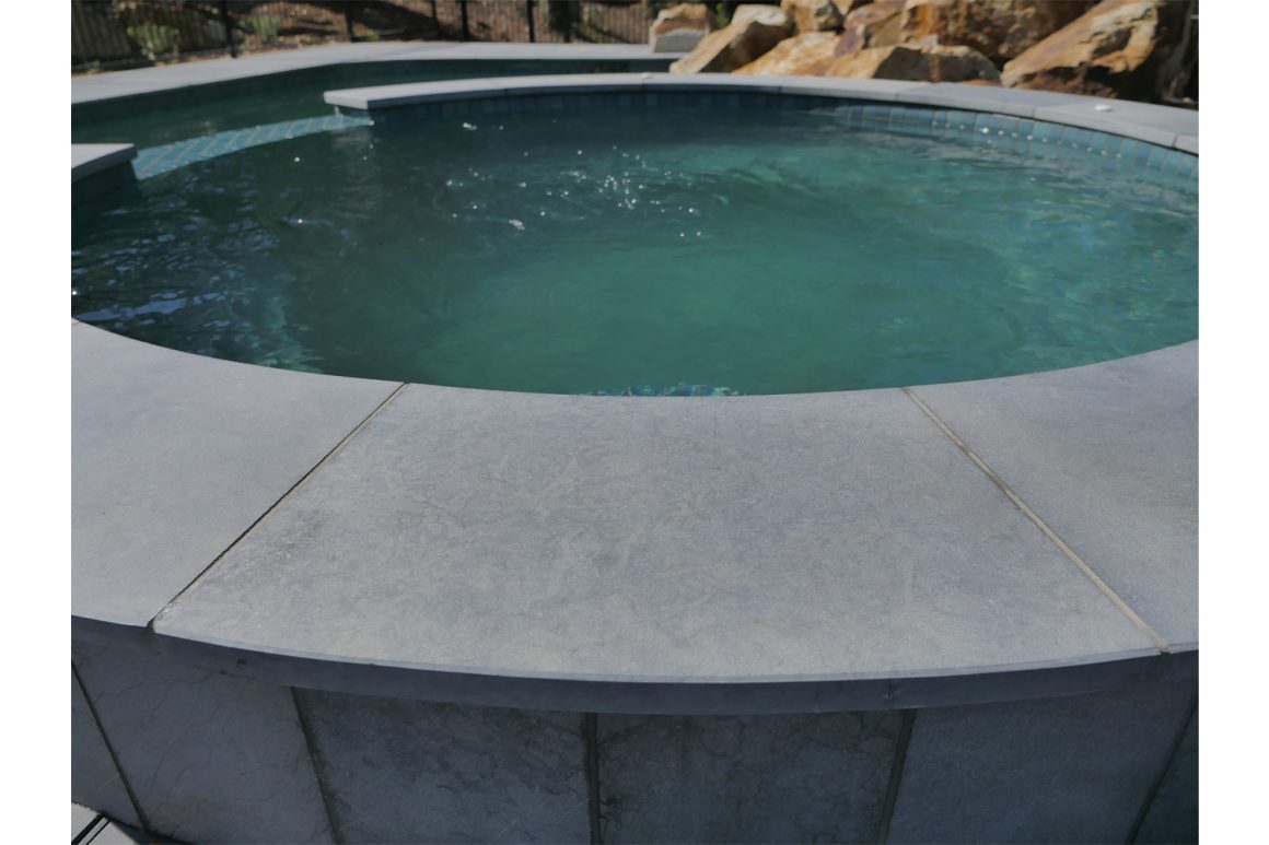 A Special Curved Limestone Coping Completes this Project - Completehome