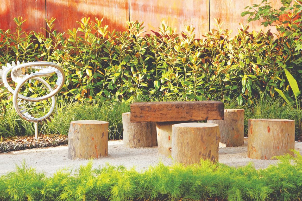 Add some outdoor art to create a calm space that celebrates nature and art
