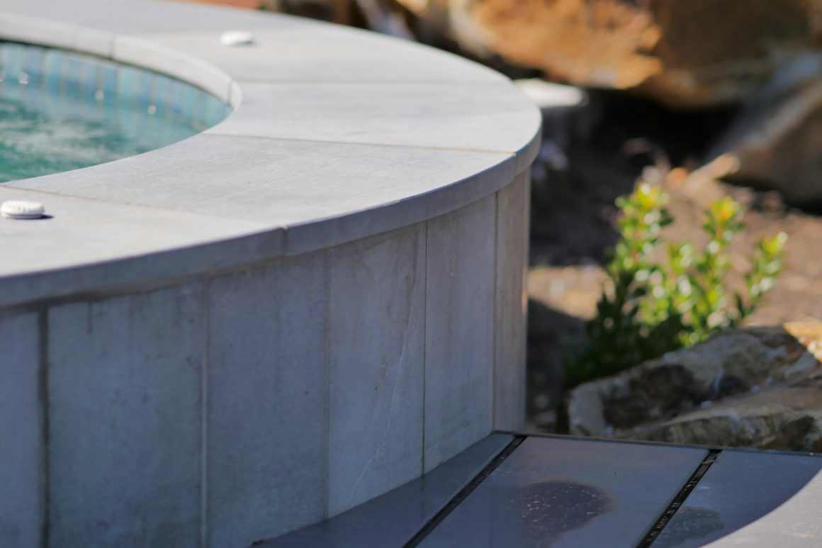 A Special Curved Limestone Coping Completes This Project - Completehome