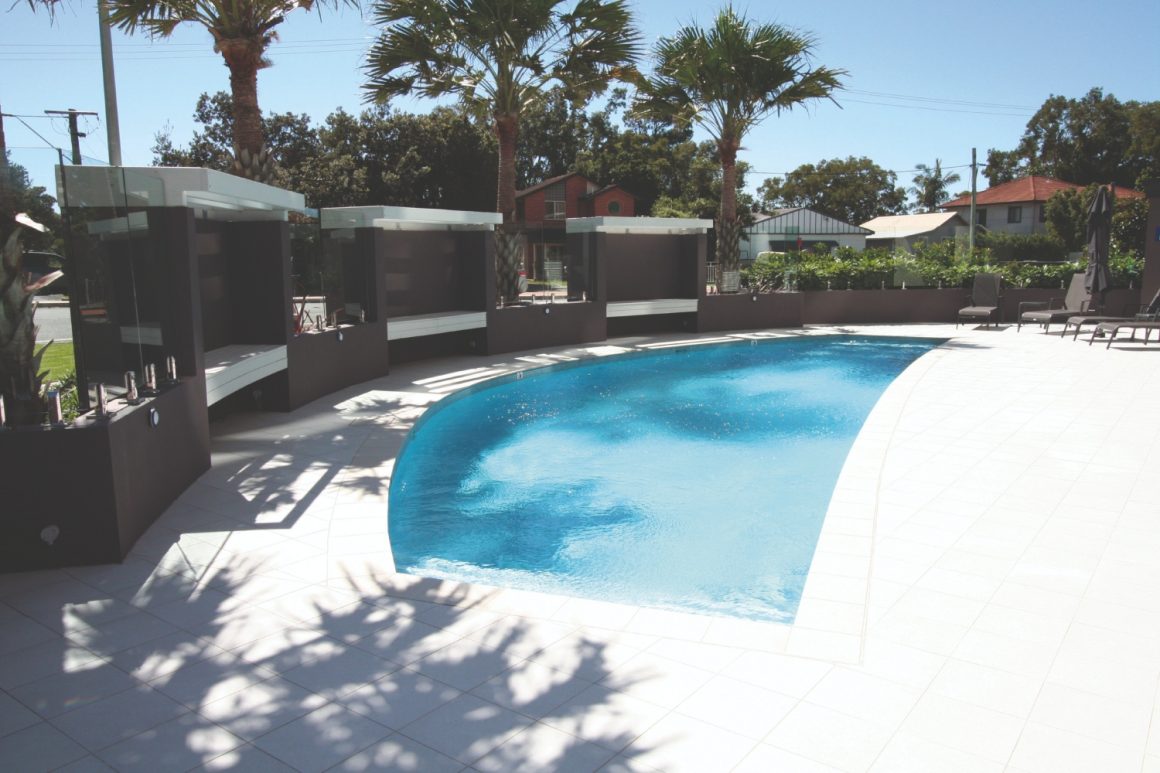 A custom curved pool was the right fit for this apartment complex