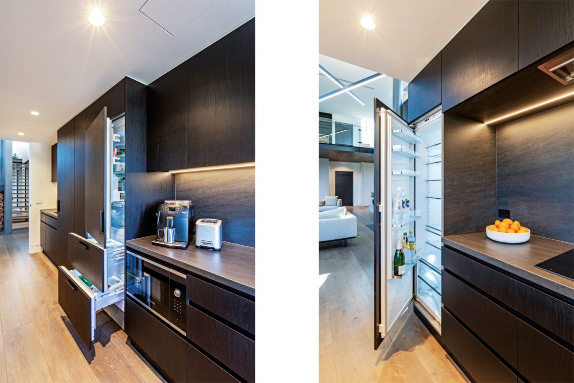 This spectacular kitchen features an island bar as a design statement ...