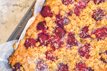 Raspberry & Coconut Traybake - WellBeing Magazine